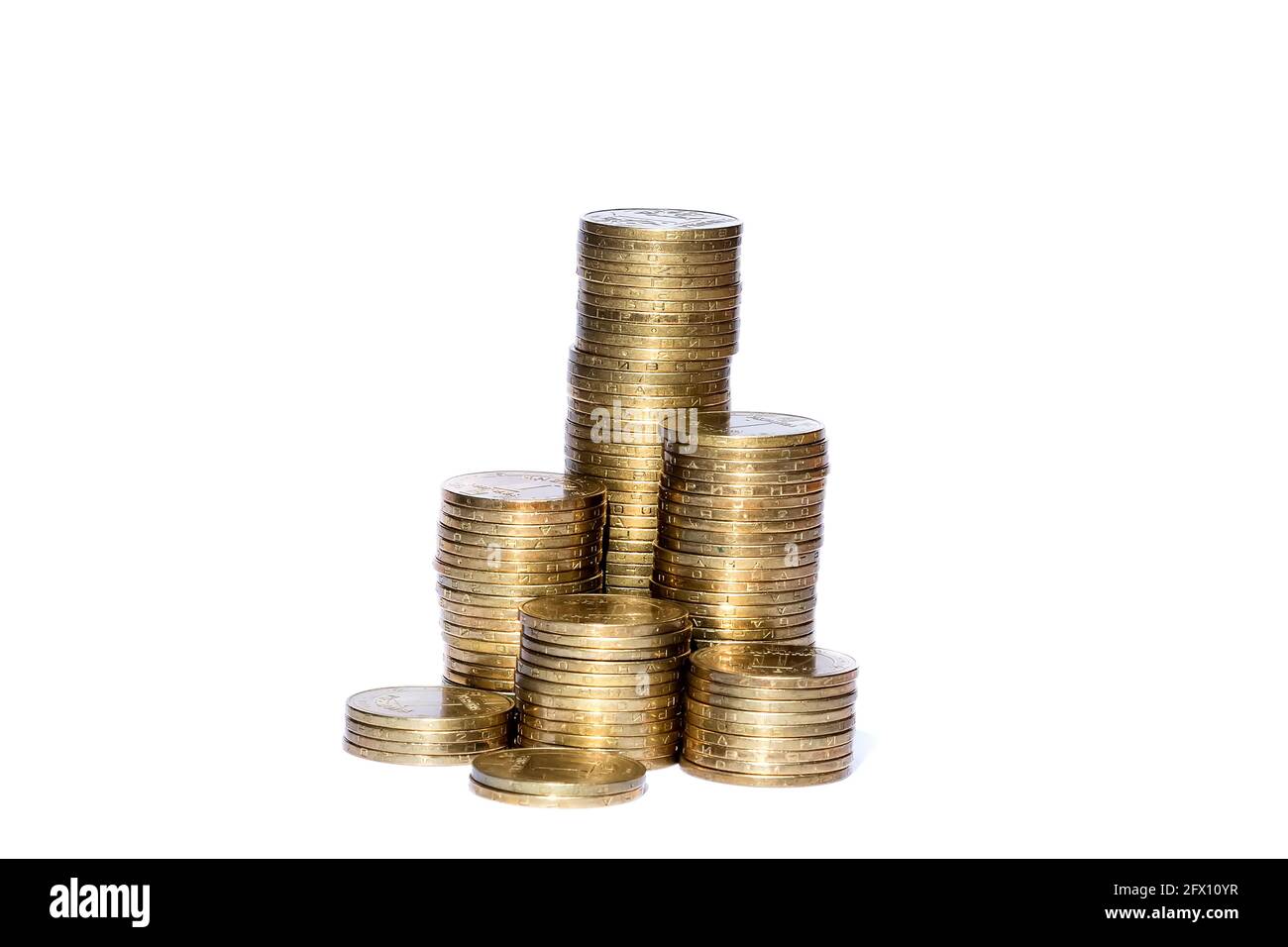 Many coins in column isolated on white background Stock Photo - Alamy
