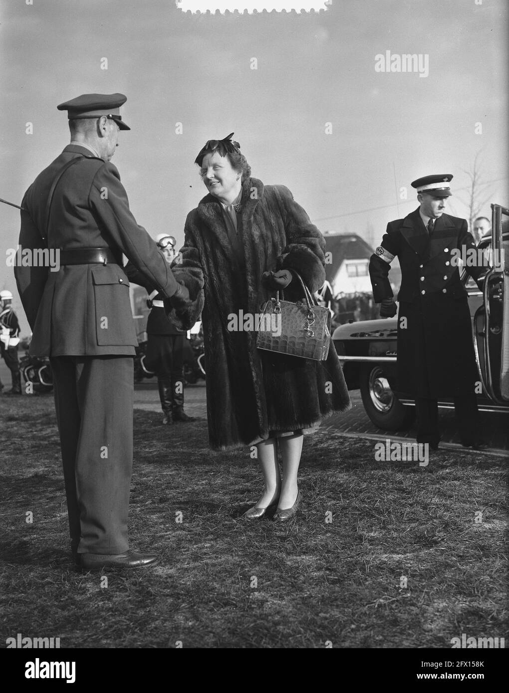 Queen Juliana is welcomed on arrival by an officer, December 22, 1955 ...