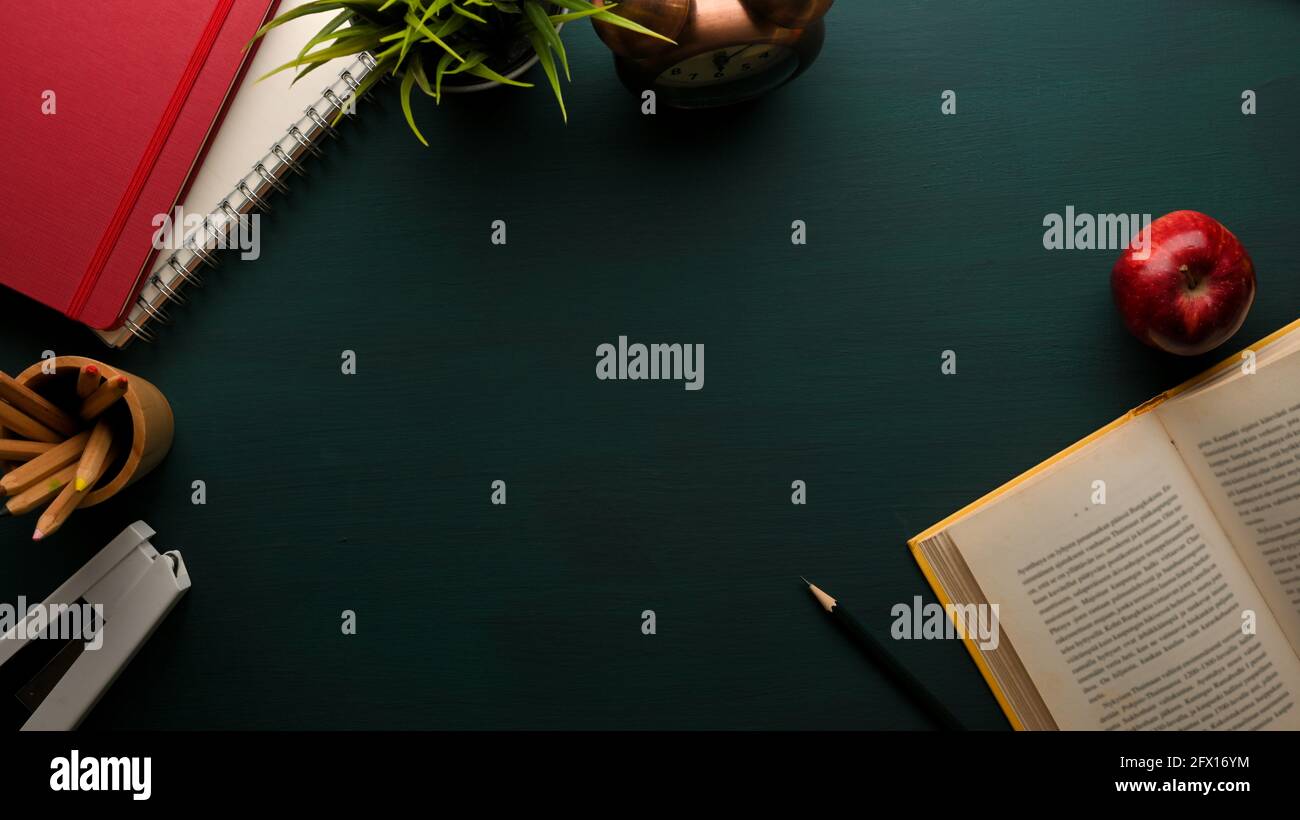 Top view of study table with book, stationery, notebook, supplies and ...