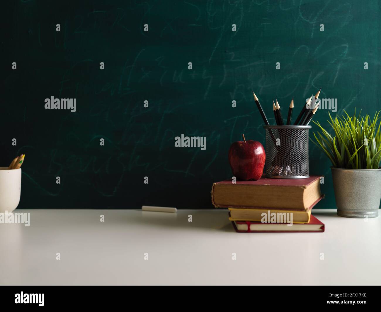 Close up view of books and school elements on study table in class room ...