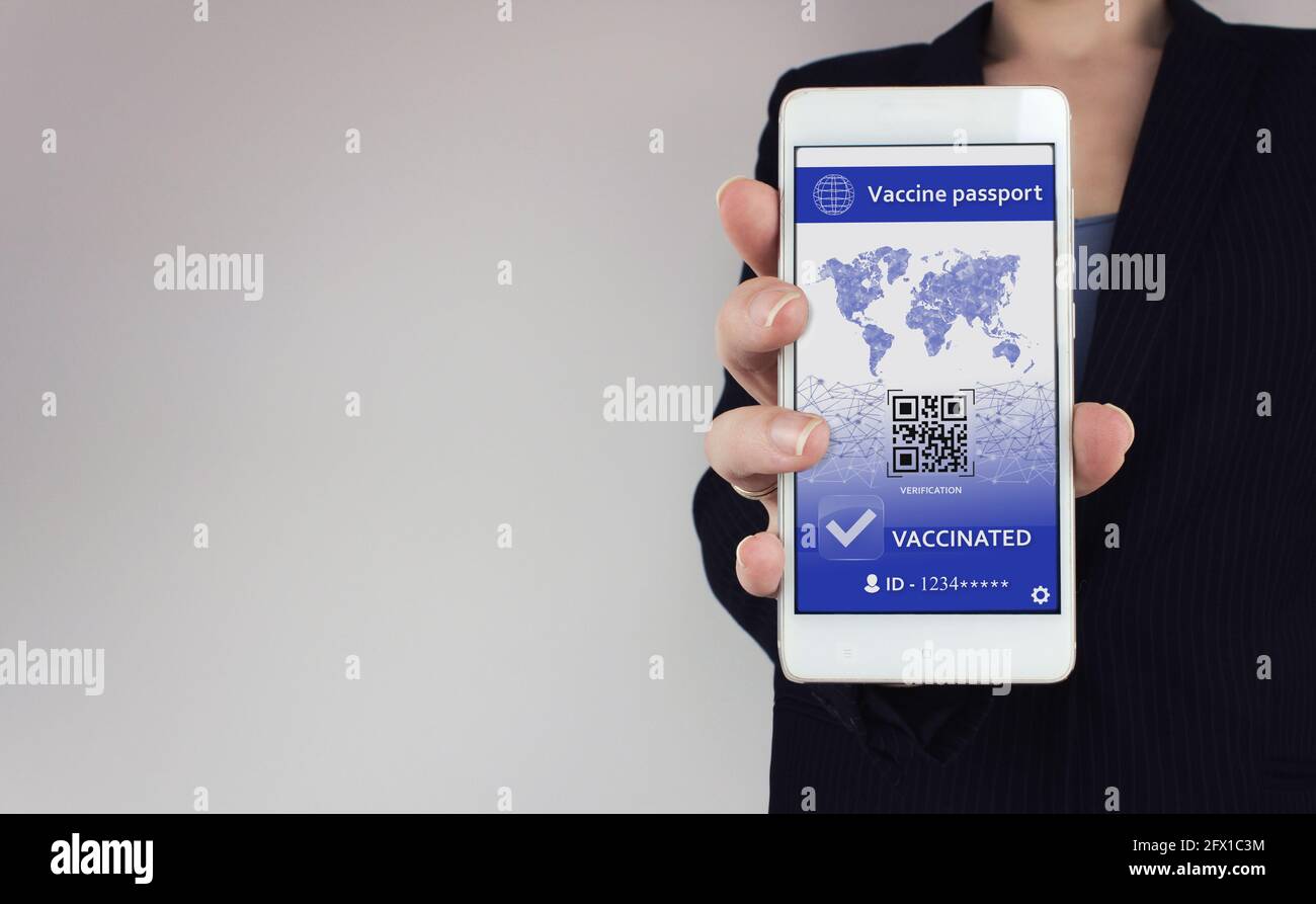 Digital vaccination certificate for COVID-19 in hand Stock Photo - Alamy