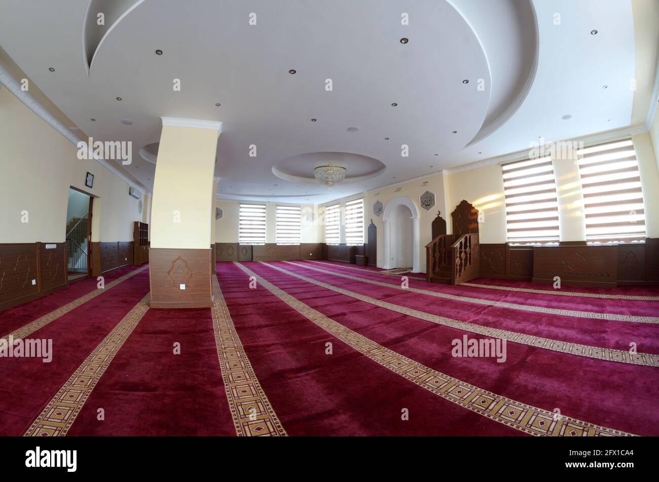 Hall for praying (iwan) of a mosque with minbar (pulpit). Islamic ...