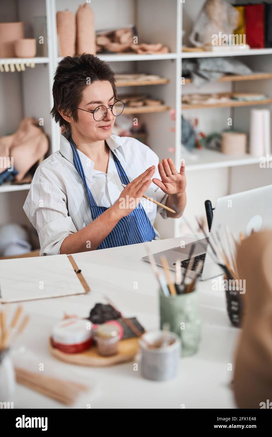 Pot maker deciding the best shape for new pottery product Stock Photo ...