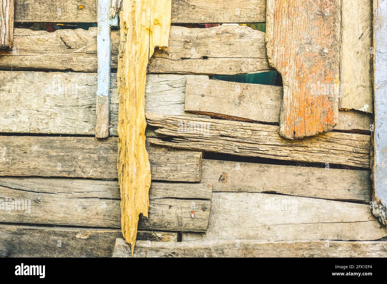 Scruffy wooden background and deteriorated construction material ...