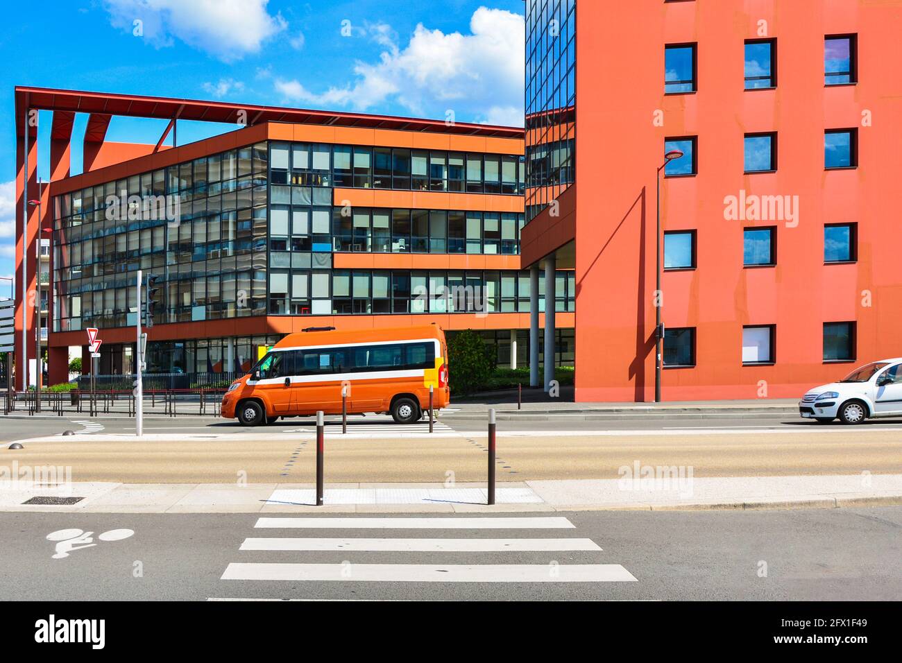 Modern red building with glass windows Sky background Stock Photo - Alamy