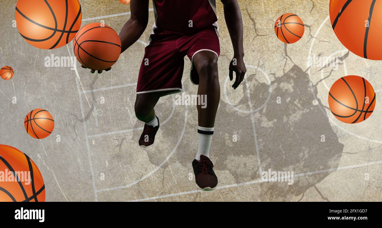 Composition of basketball player and basketballs over basketball court ...