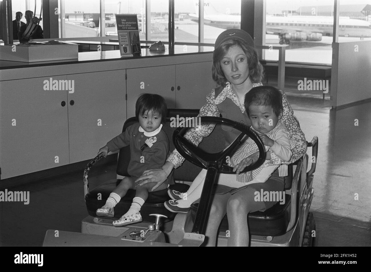 Korean orphans at Schiphol Airport, flight attendant with two Koreans ...