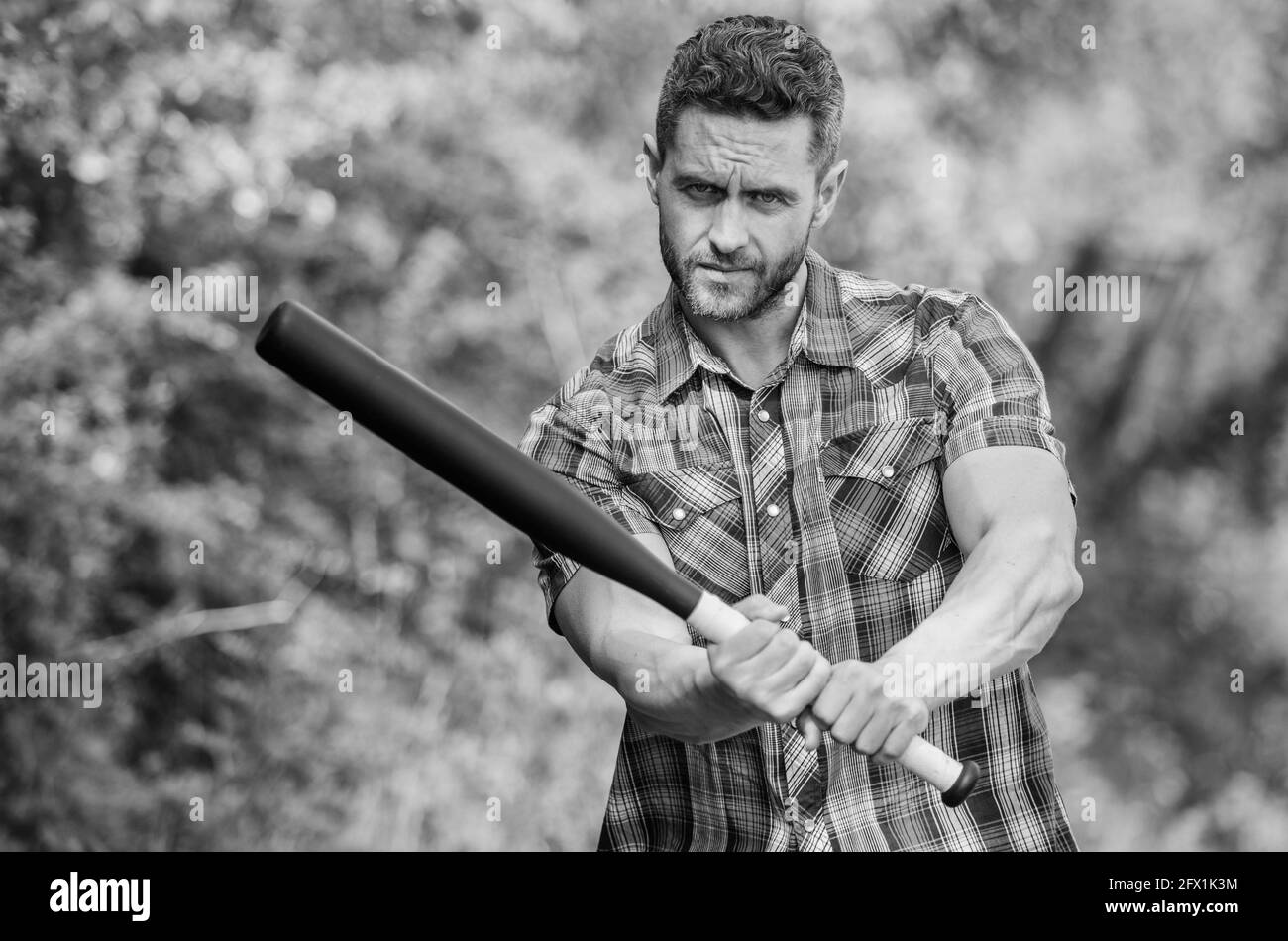 man with baseball bat. i am a criminal. outdoor sport activity ...