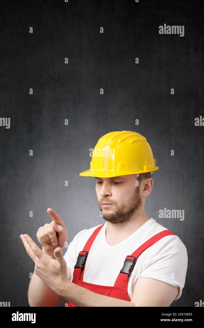Portrait of a counting construction worker Stock Photo - Alamy
