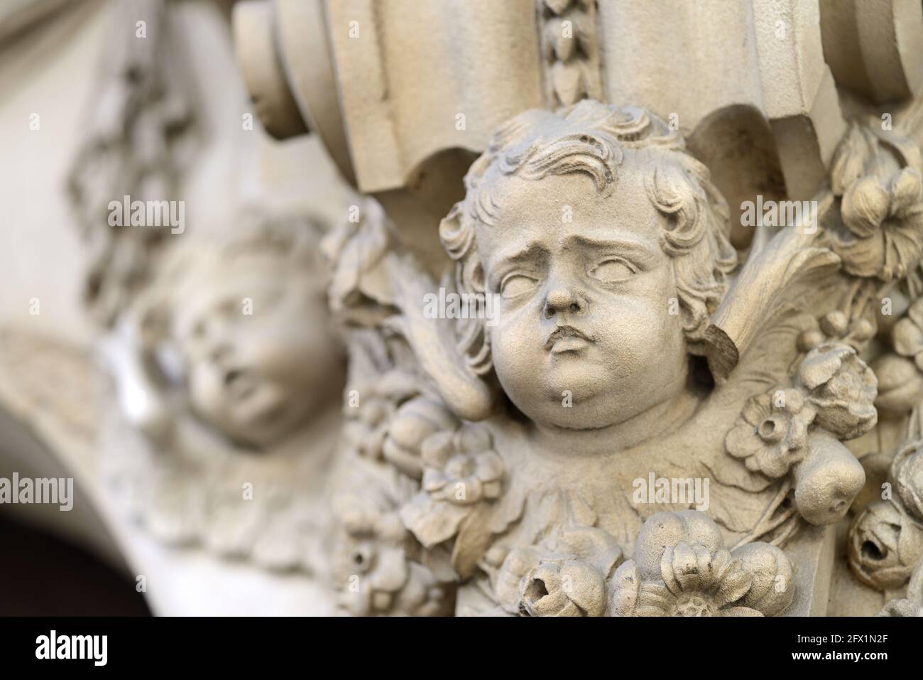 London, England, UK. St Paul's Cathedral. Cherubs around the north west ...