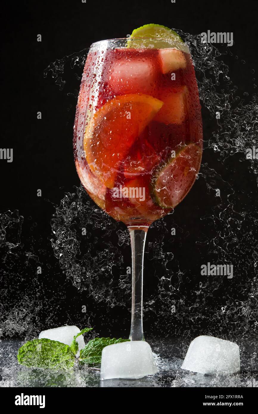 Fresh summer sangria splashing on slate background Stock Photo - Alamy