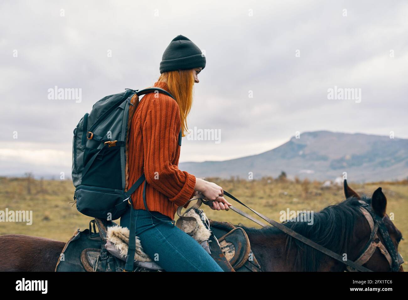 woman hiker with backpack riding horse landscape mountains fresh air ...