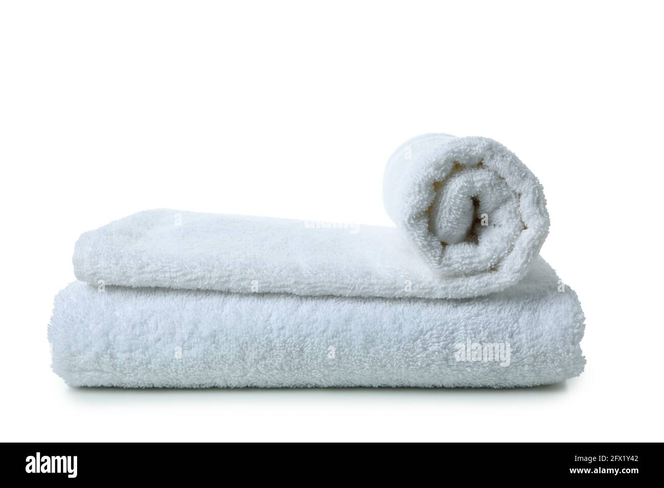 Folded clean towels isolated on white background Stock Photo - Alamy