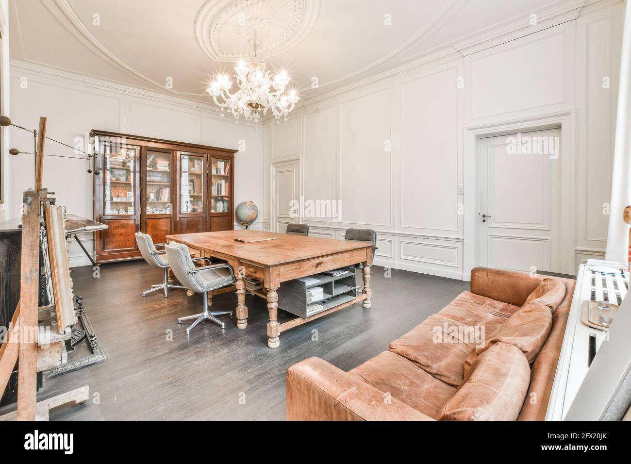 Classic interior of mansion work room with wooden table and cupboard ...