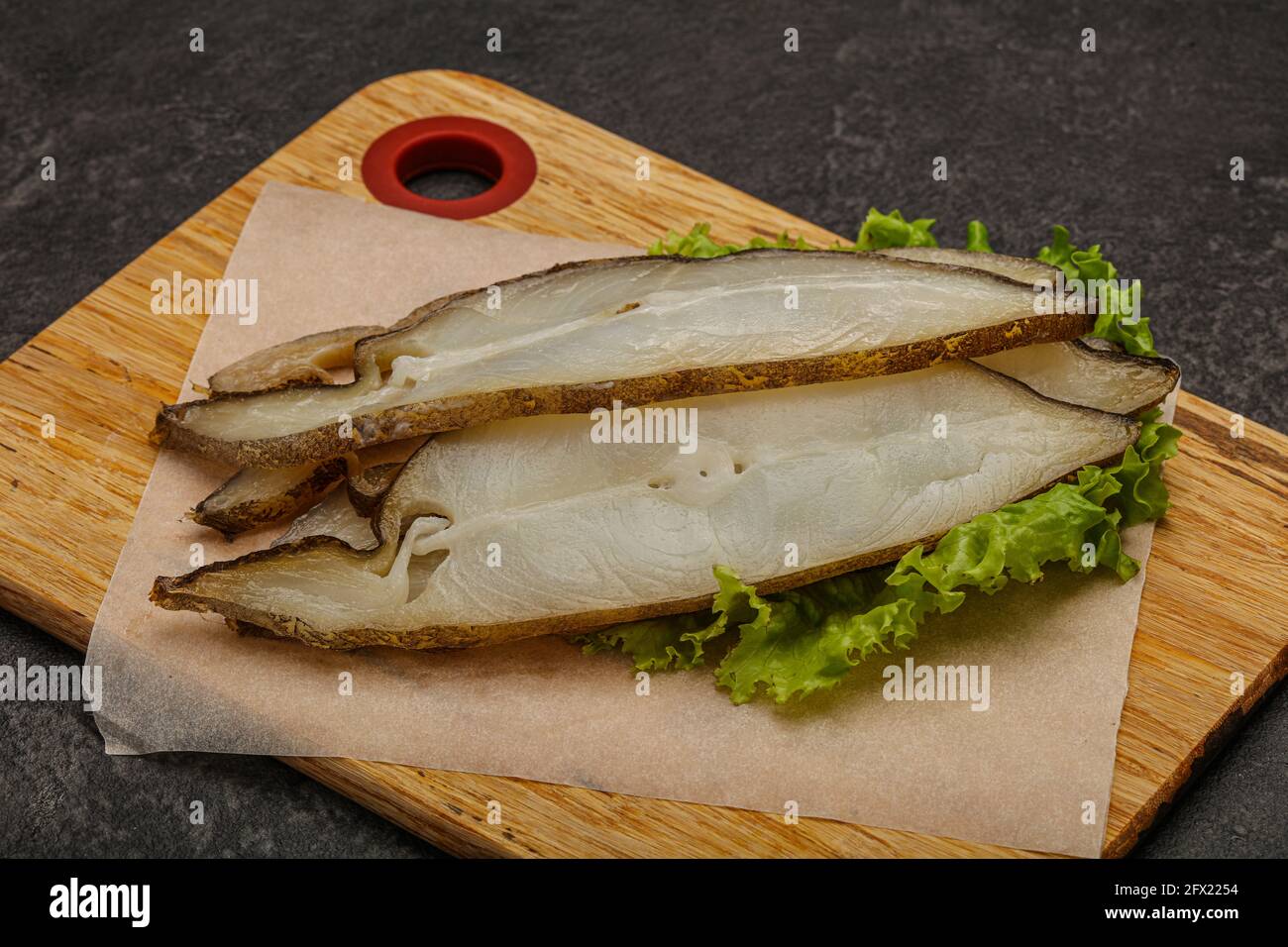 Delicous smoked halibut fish slices snack Stock Photo - Alamy