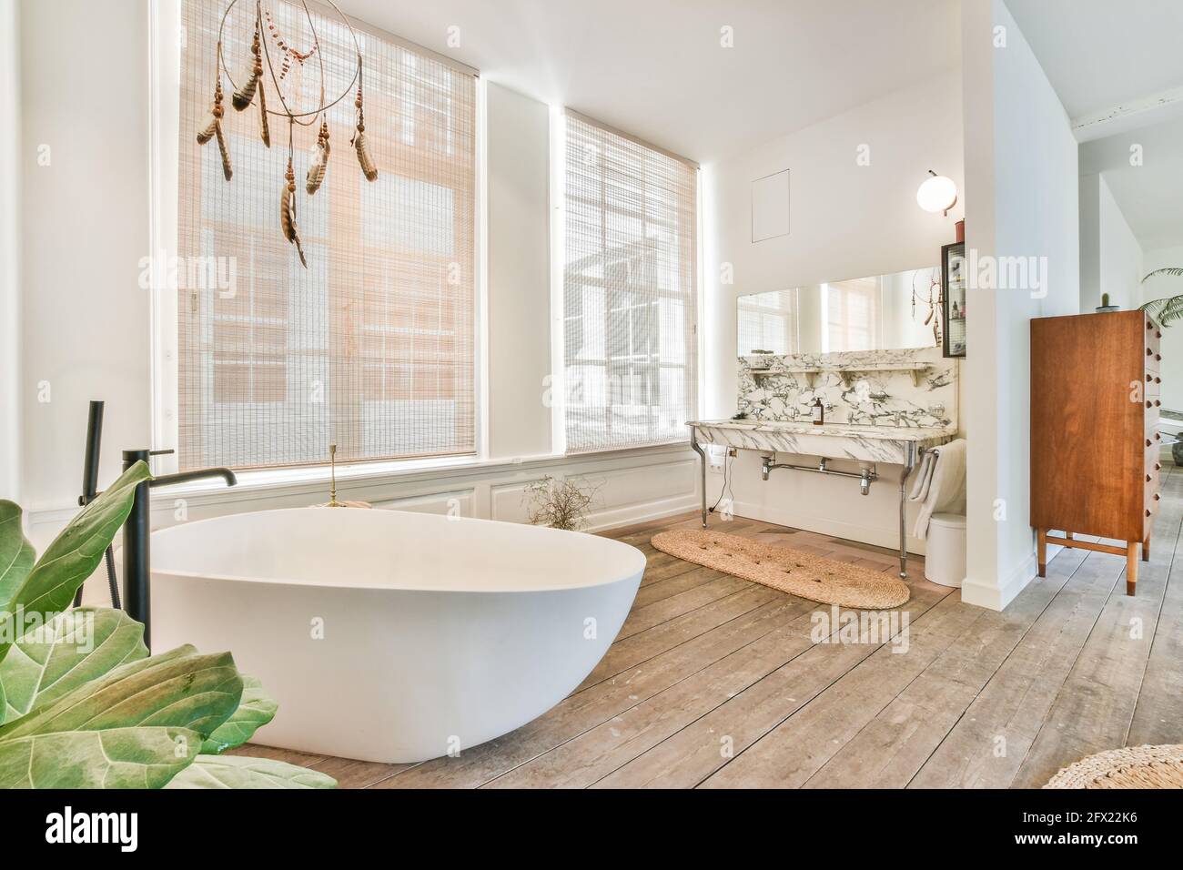 Spacious open bathroom area with soaking tub and double marble sink ...