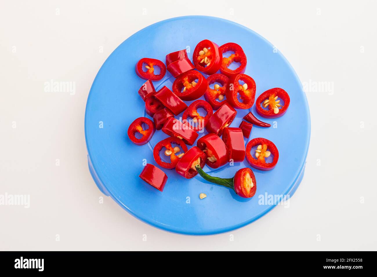 red hot chili pepper on the blue plate Stock Photo - Alamy