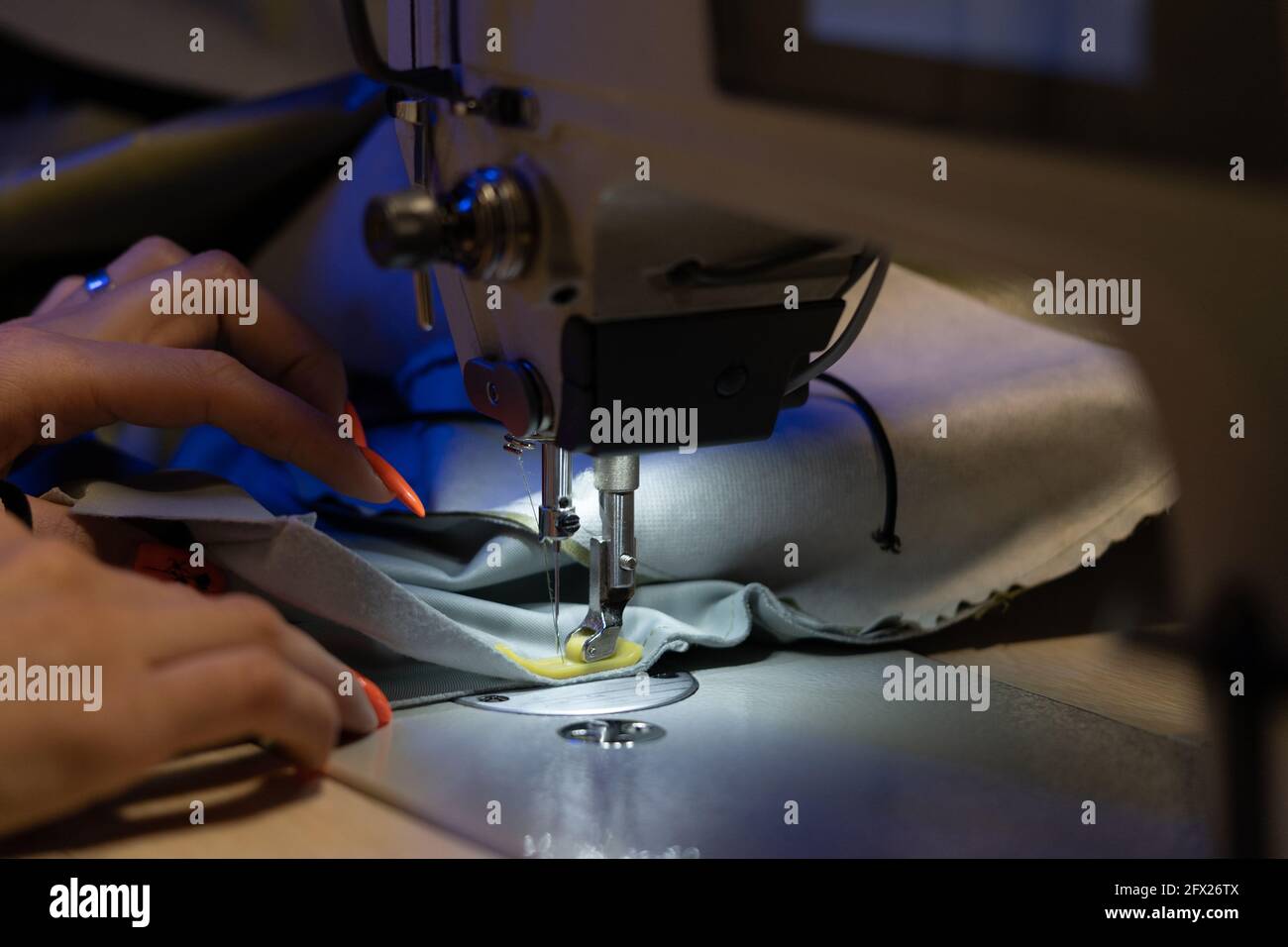 Seamstress work on sewing machine, closeup. Woman fashion designer ...