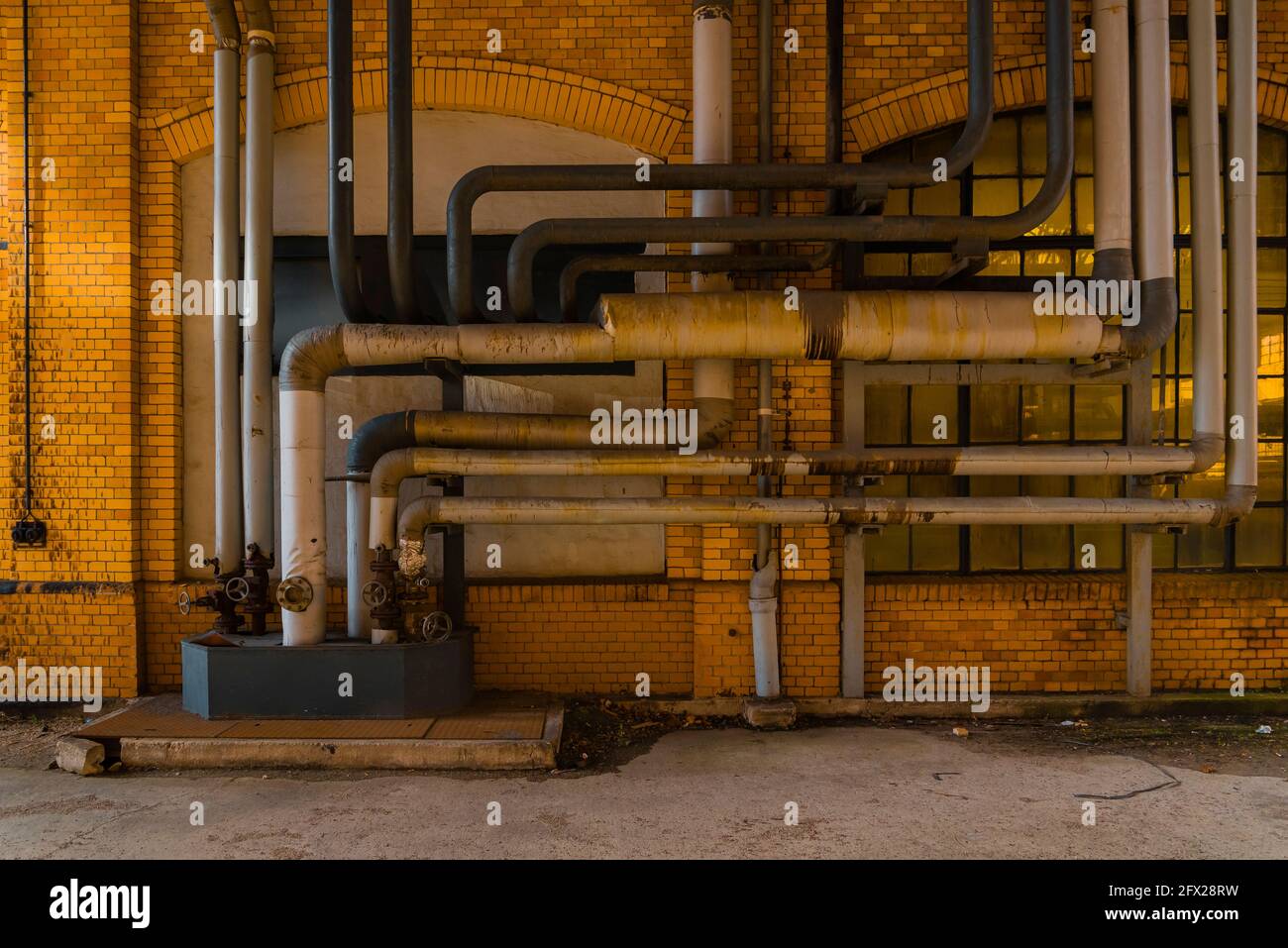 Old pipes on an industrial facade Stock Photo - Alamy