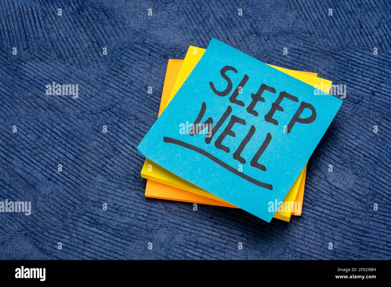 sleep well reminder, advice or wish, handwriting on a reminder note ...