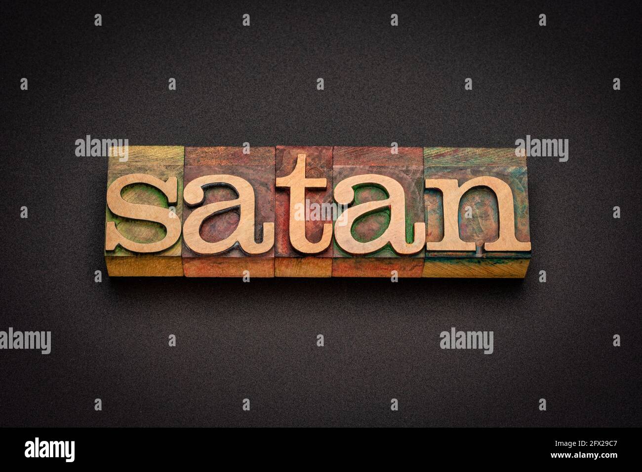 satan word abstract in vintage letterpress wood type, religious concept ...
