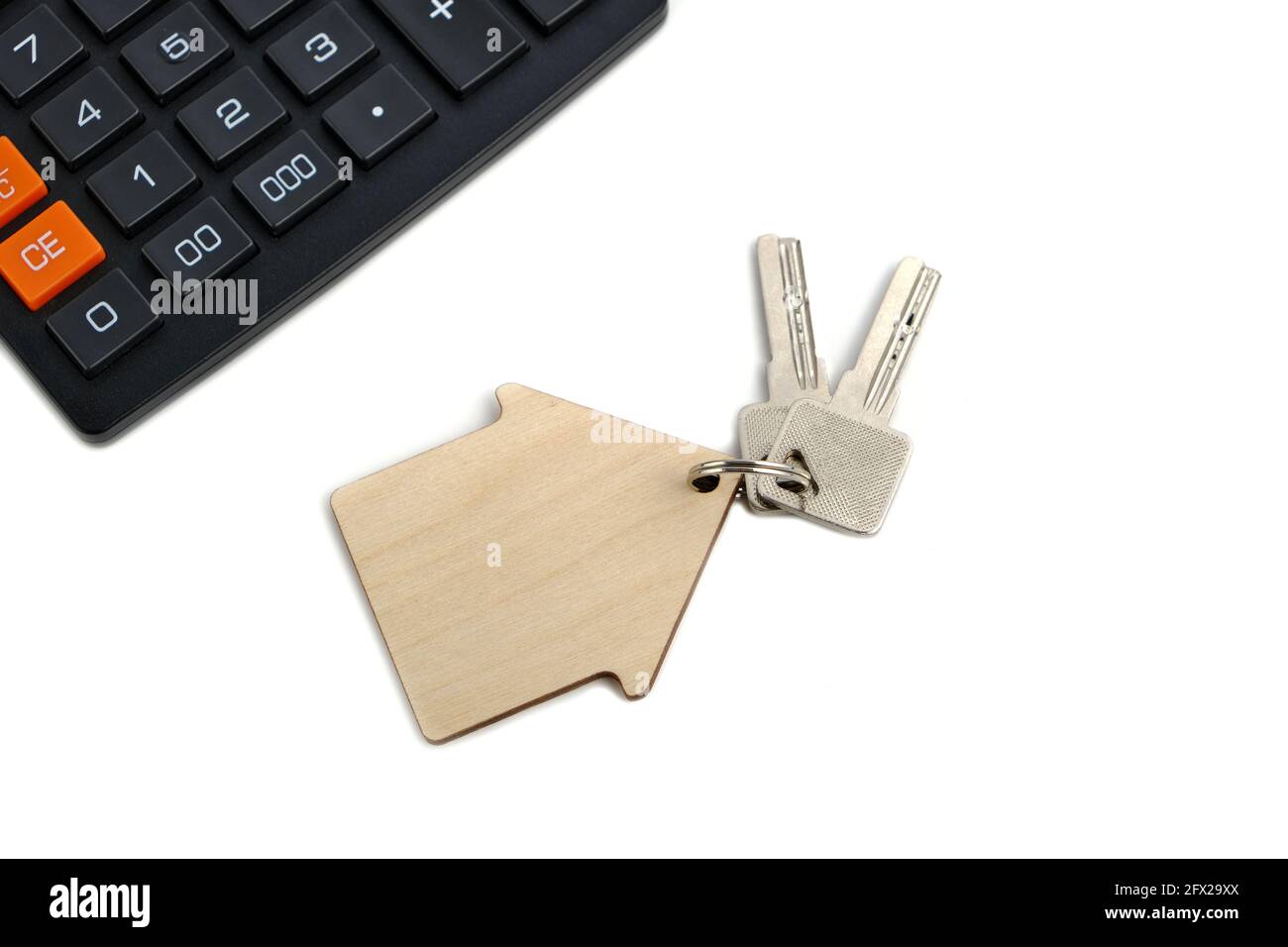 Calculator and house keys.Concept of buying and selling housing ...