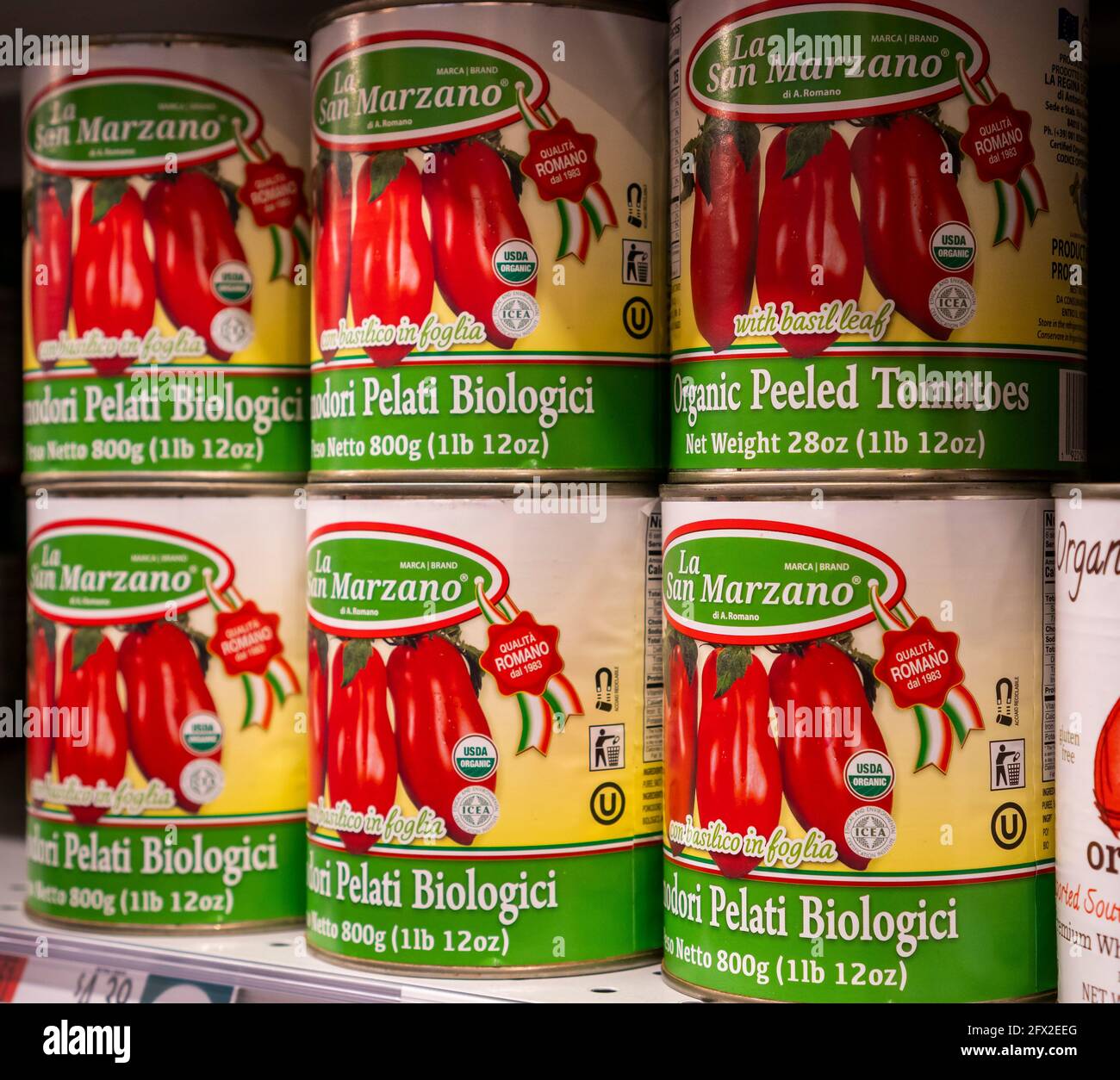 Cans of imported Italian tomatoes in a supermarket in New York on ...