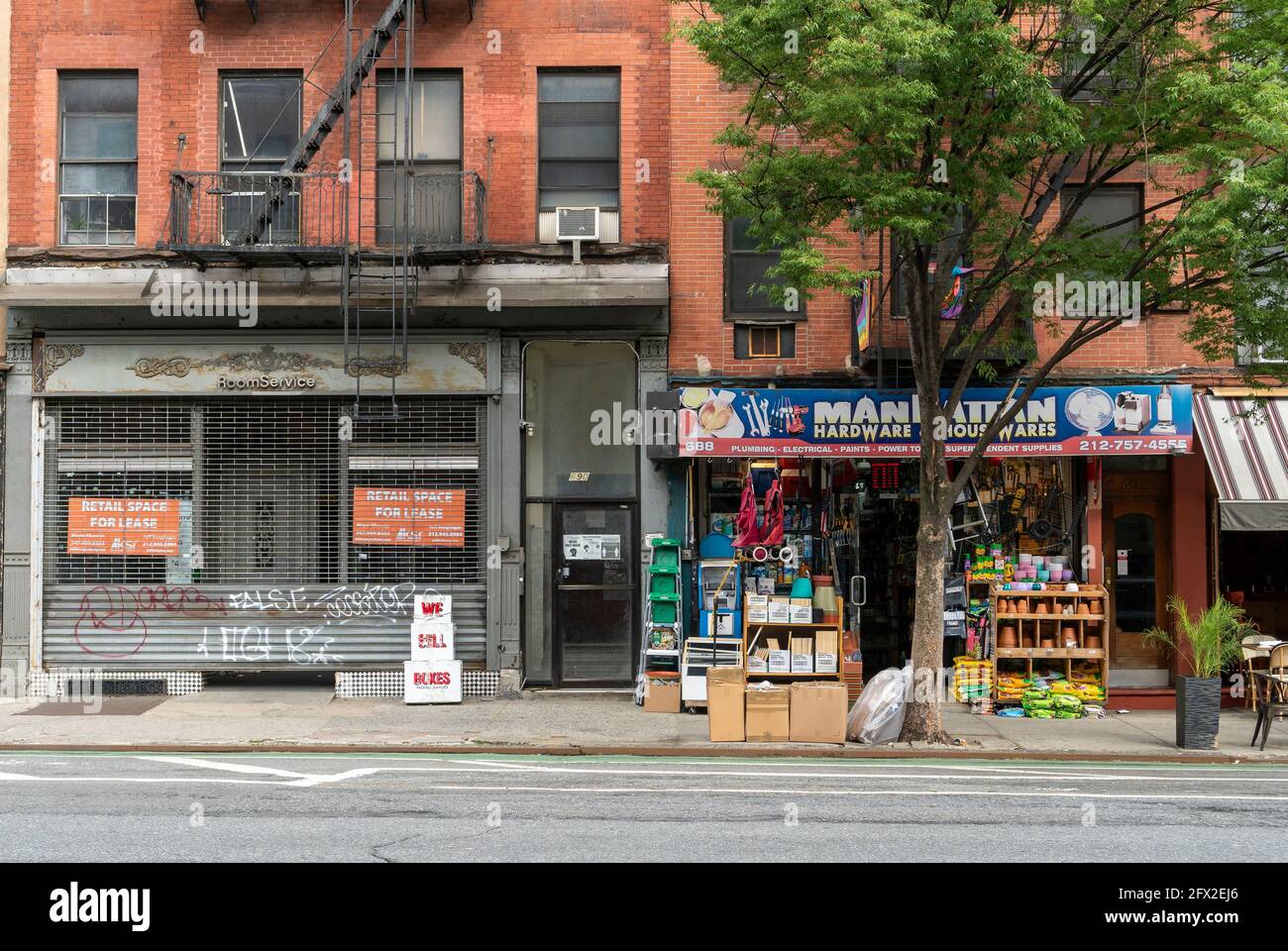 Closed storefront next to a â€œmom and popâ€ dry goods store in the ...