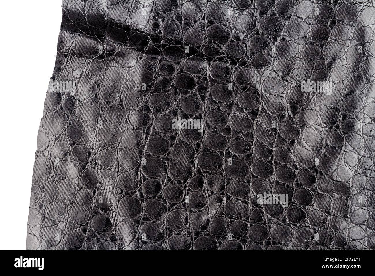 Piece of black artificial leather isolated on white background. Fake ...