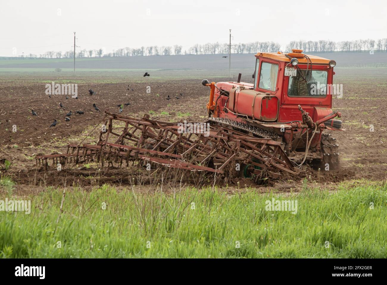 Caterpillar tractor plows land hi-res stock photography and images - Alamy