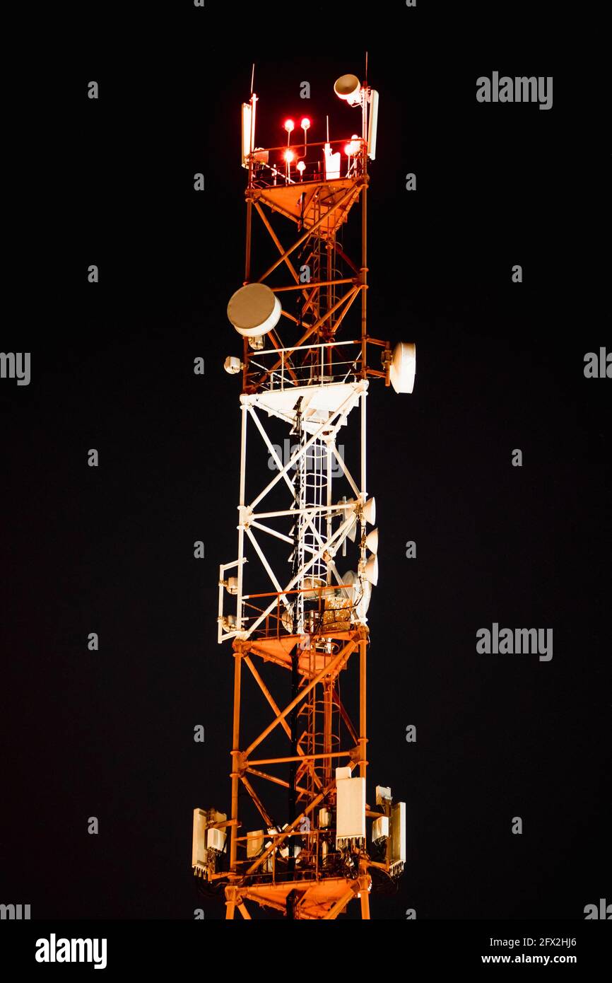 Cell tower on a black background. Mobile communication base station in ...