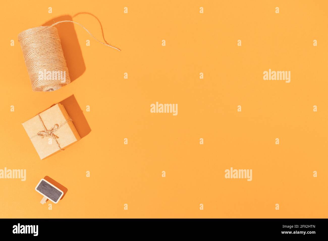 Handmade craft gift box with skein of jute rope and wooden badge on ...