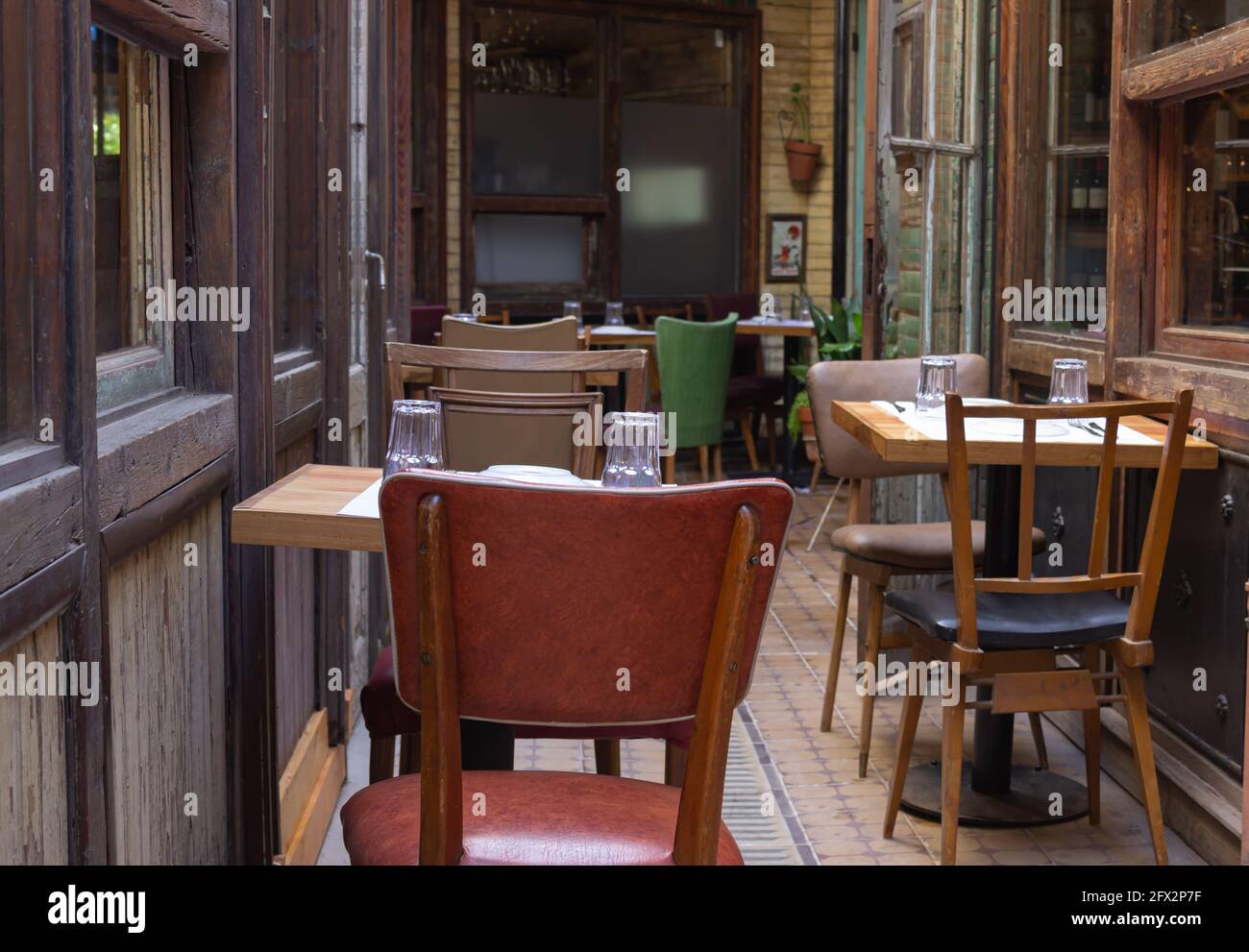 Outdoor restaurant with empty tables Stock Photo - Alamy