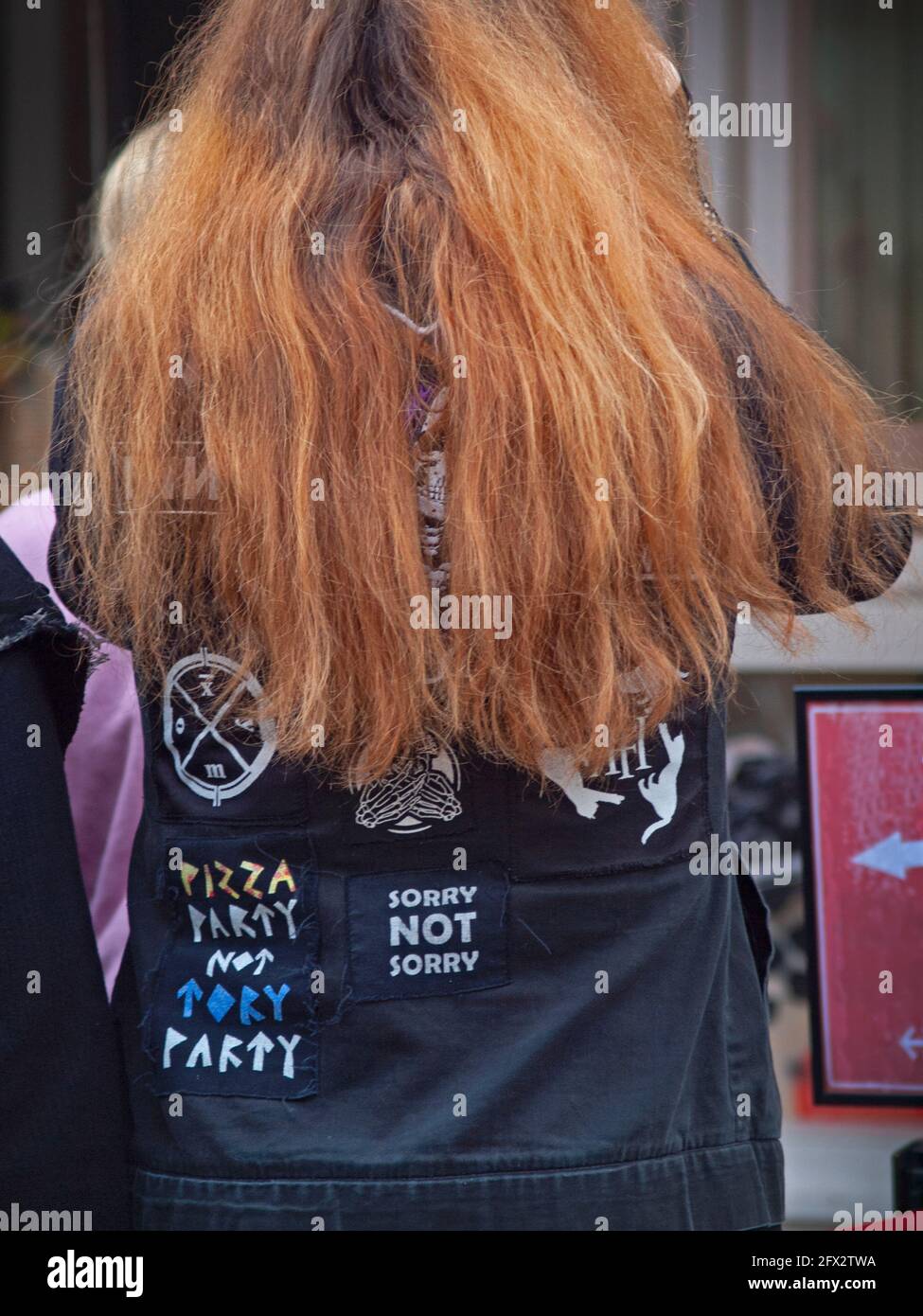 Long hair overhanging a customised jacket Stock Photo - Alamy