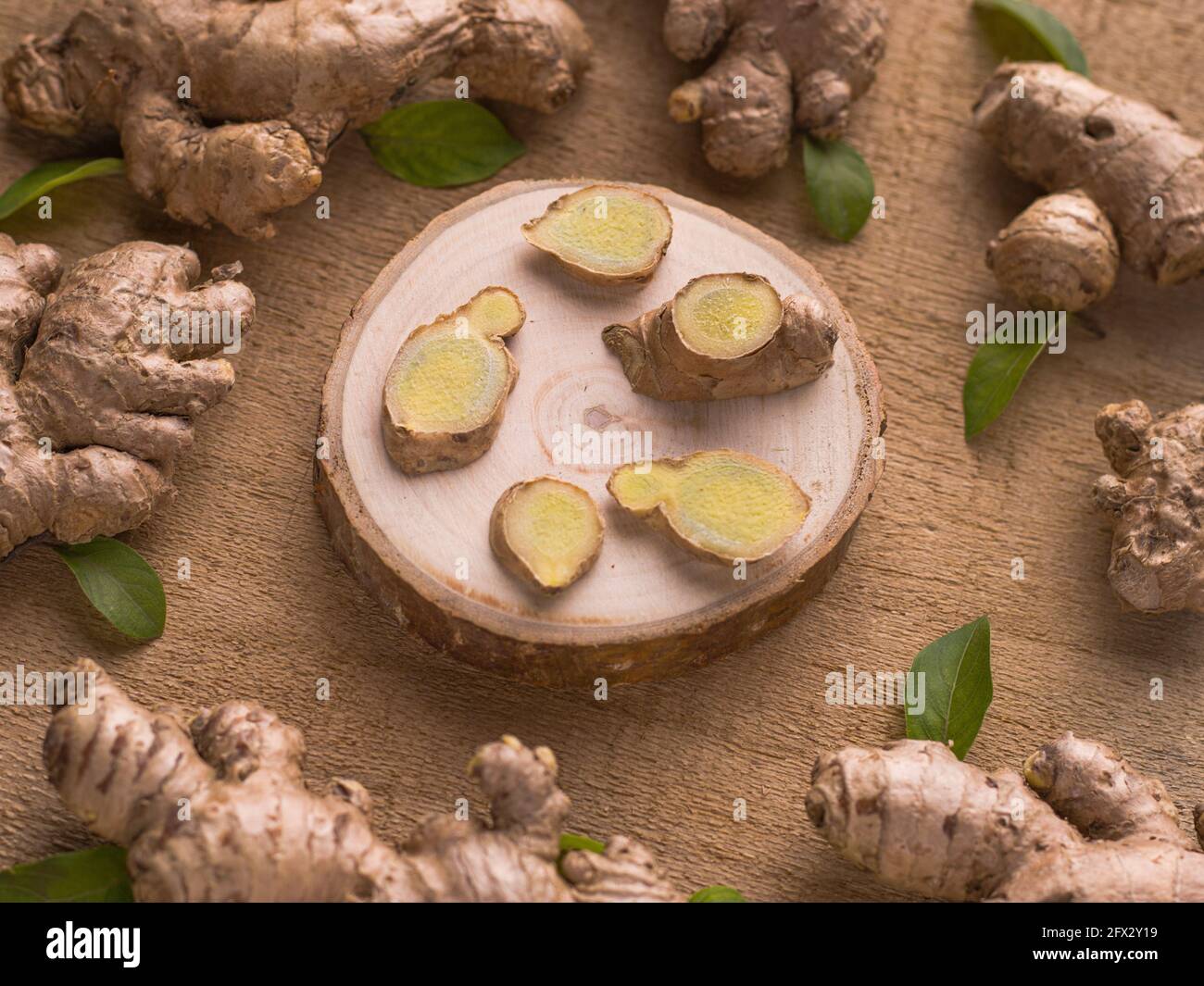 Fresh Ginger on wooden texture background stock image Stock Photo - Alamy
