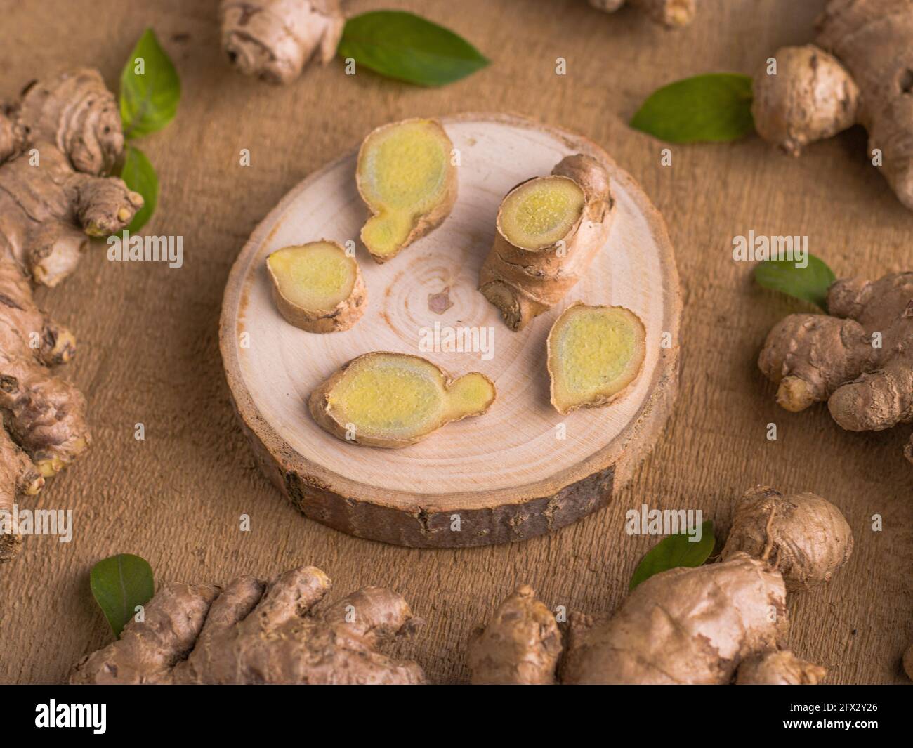 Fresh Ginger on wooden texture background stock image Stock Photo - Alamy