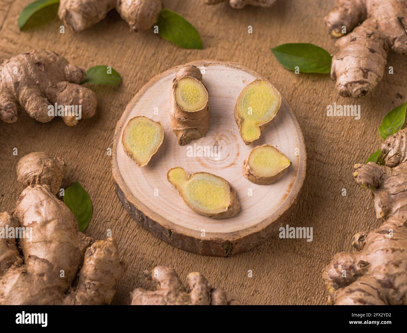 Fresh Ginger on wooden texture background stock image Stock Photo - Alamy