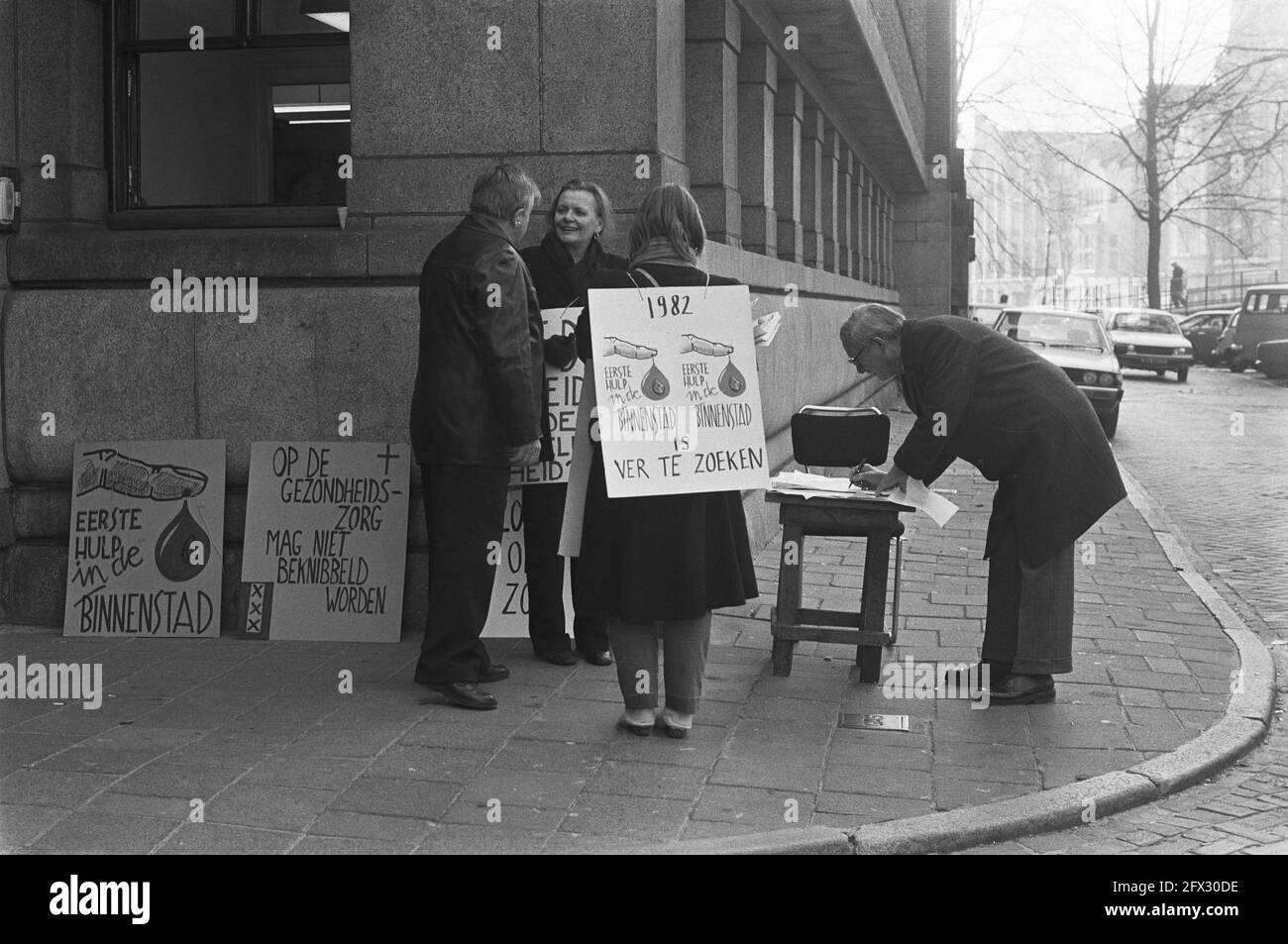Community center doude stadt hand out pamphlets hi-res stock ...