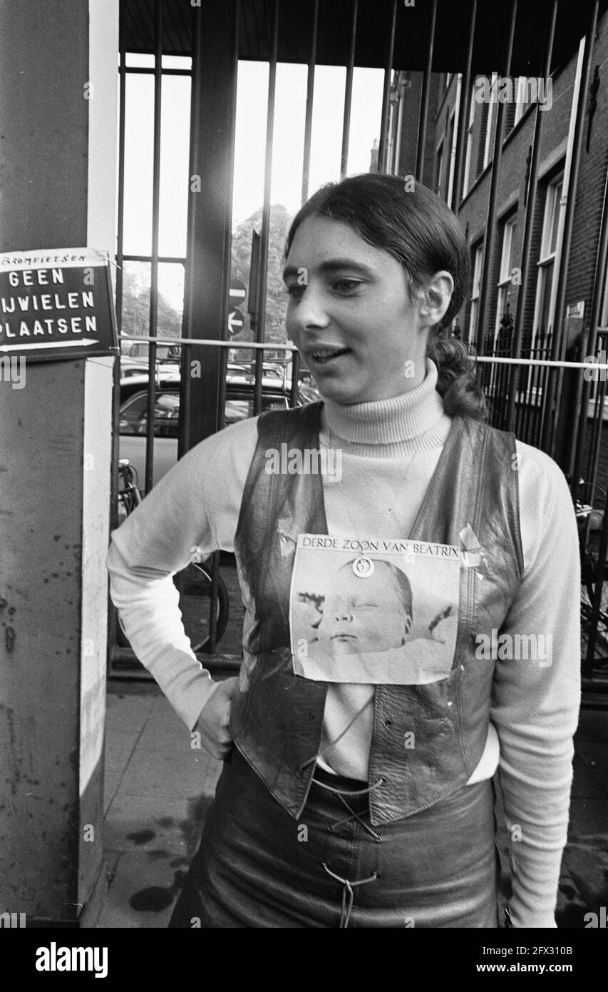 Girl with portrait of Prince Constantine pinned up in front of hospital ...