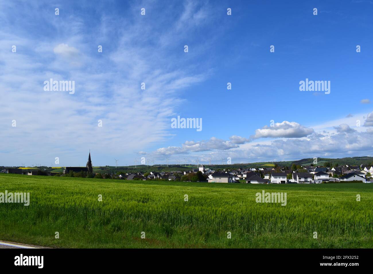 village Kehrig behind green grain fields Stock Photo - Alamy