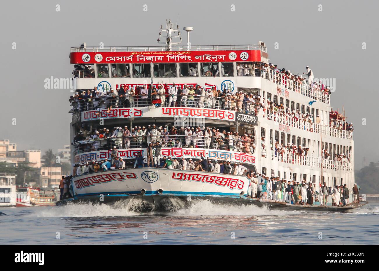 Buriganga river, Bangladesh : Overcrowded passenger ferry returning ...