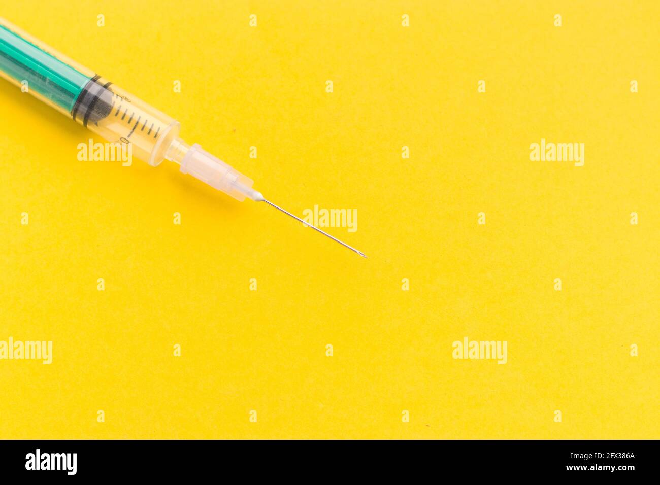 Plastic Syringe isolated stock image on texture background Stock Photo ...