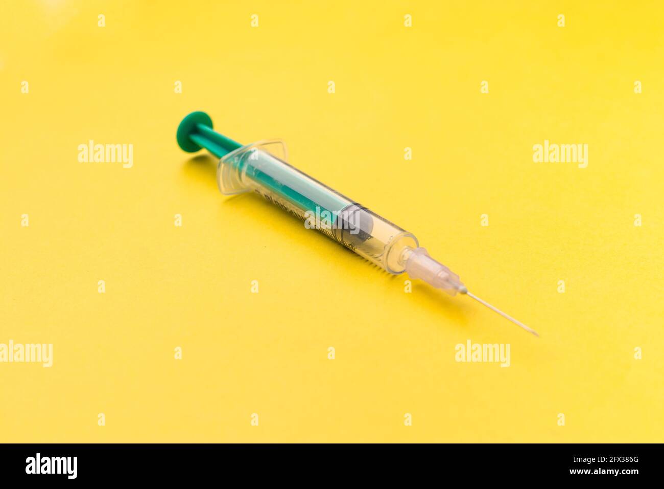 Plastic Syringe isolated stock image on texture background Stock Photo ...
