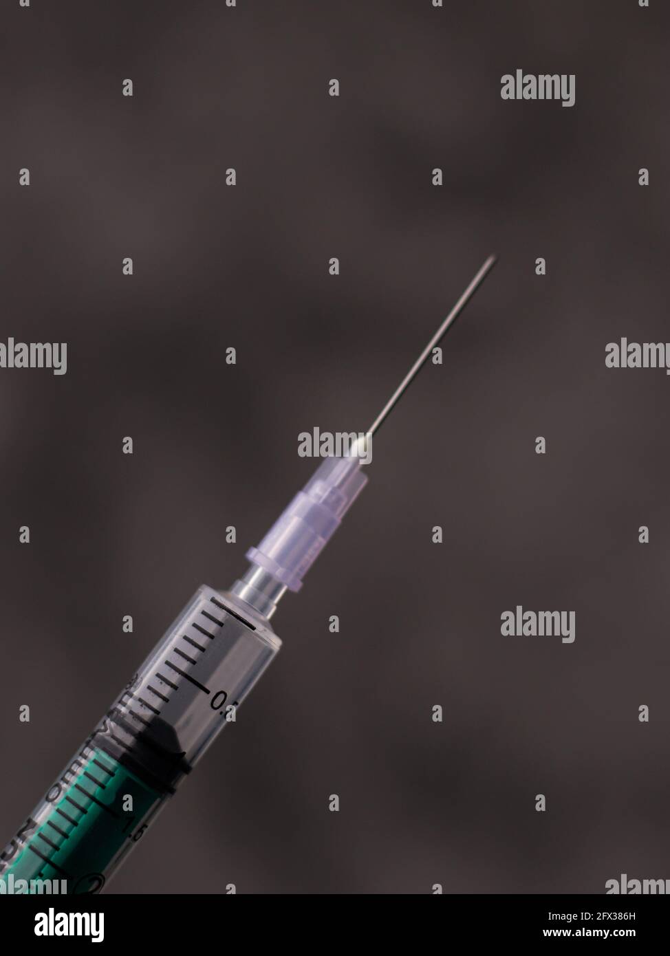 Plastic Syringe isolated stock image on texture background Stock Photo ...