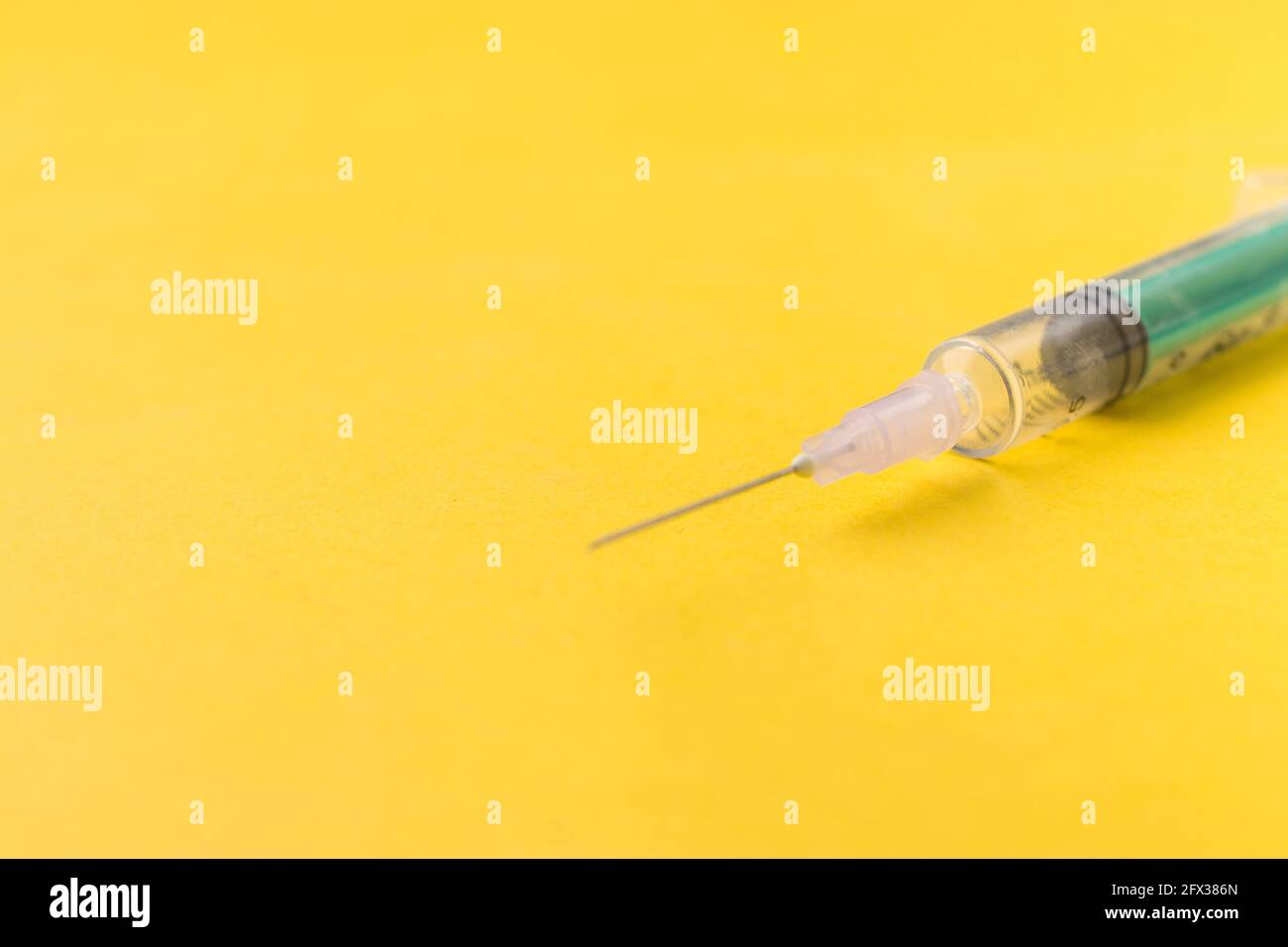 Plastic Syringe isolated stock image on texture background Stock Photo ...