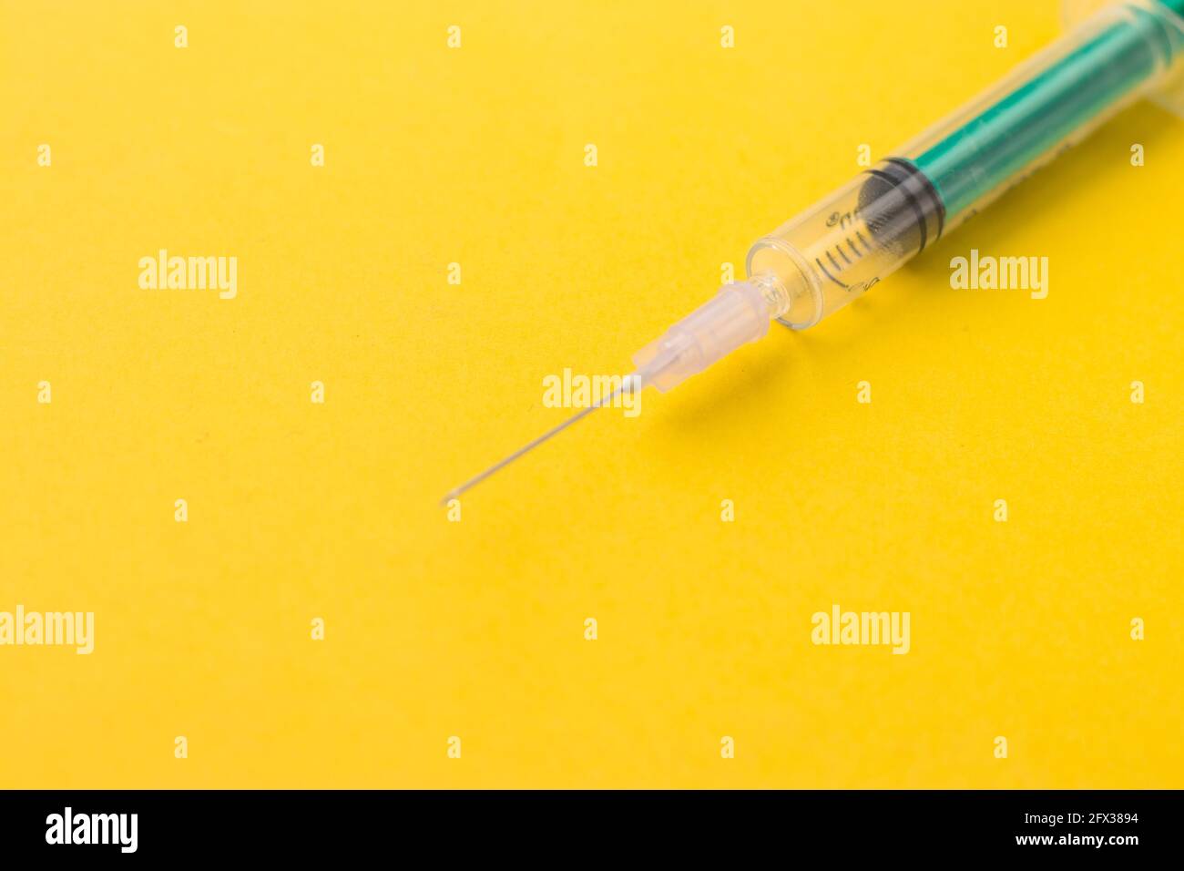 Plastic Syringe isolated stock image on texture background Stock Photo ...