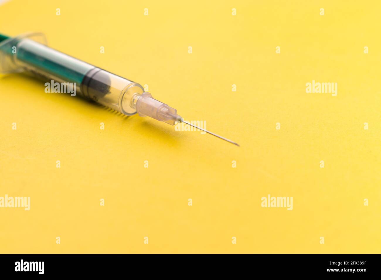 Plastic Syringe isolated stock image on texture background Stock Photo ...