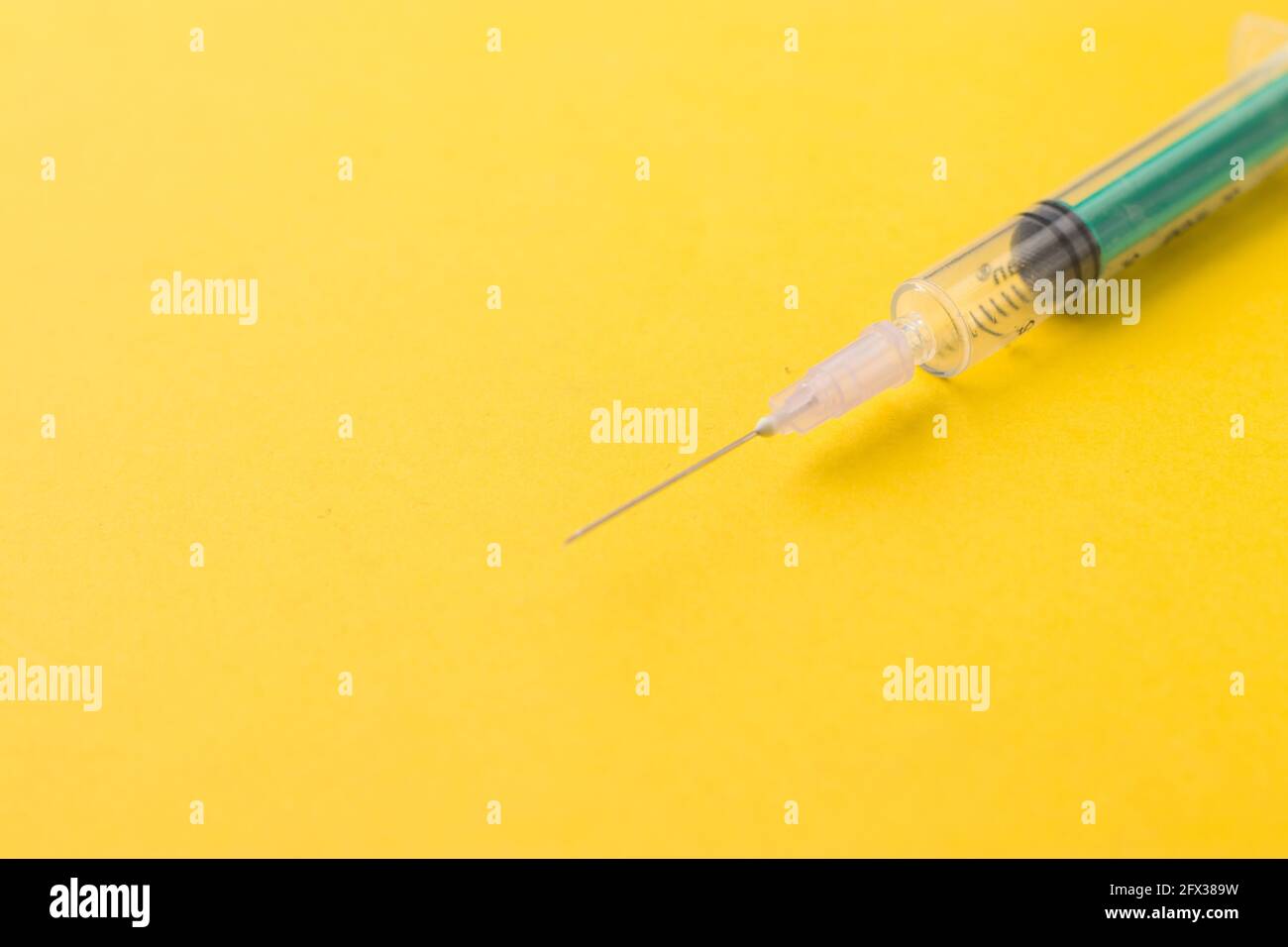 Plastic Syringe isolated stock image on texture background Stock Photo ...