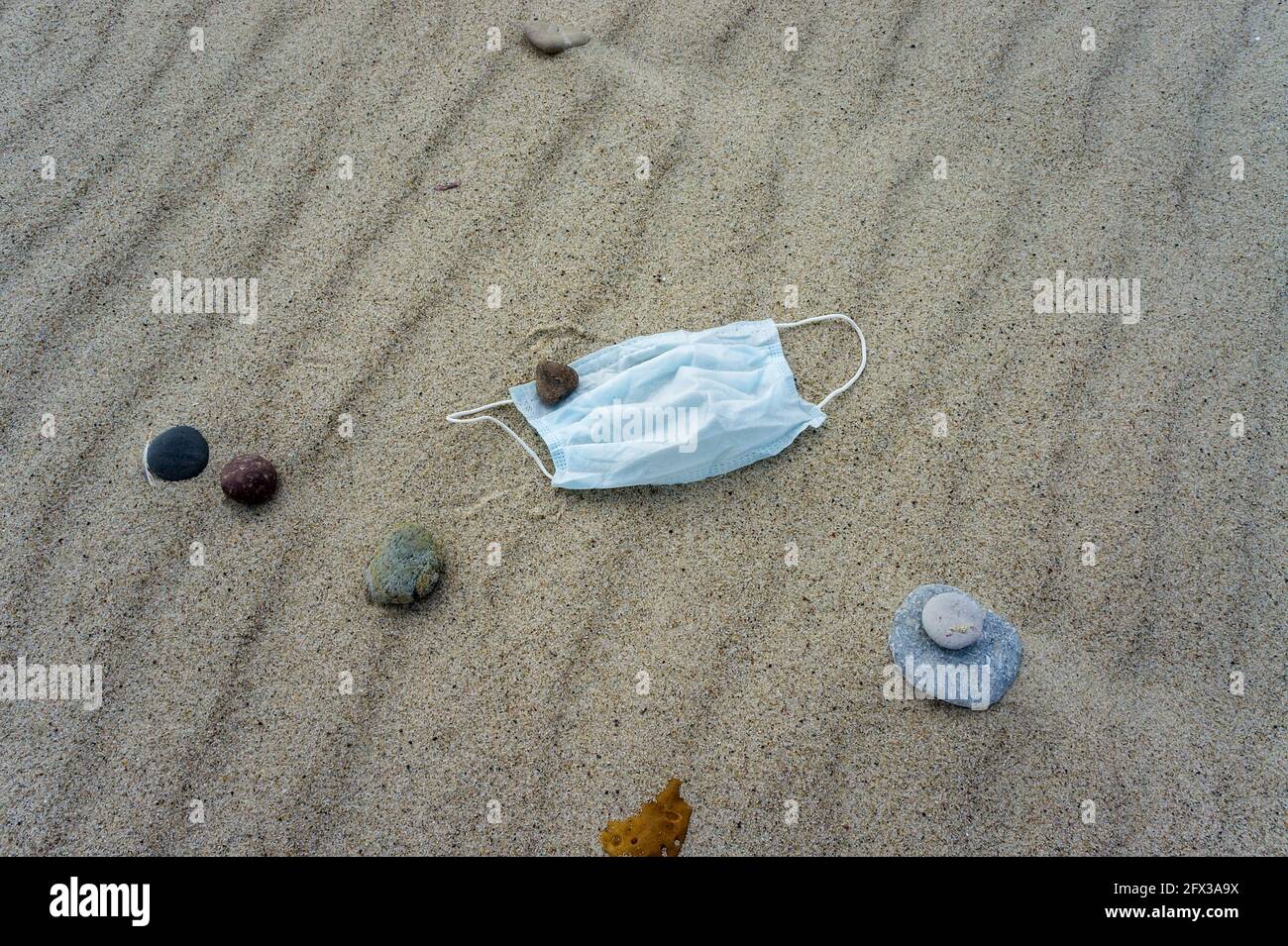 Abandoned used mask. The mask on the sand. The mask is lying on the sea ...