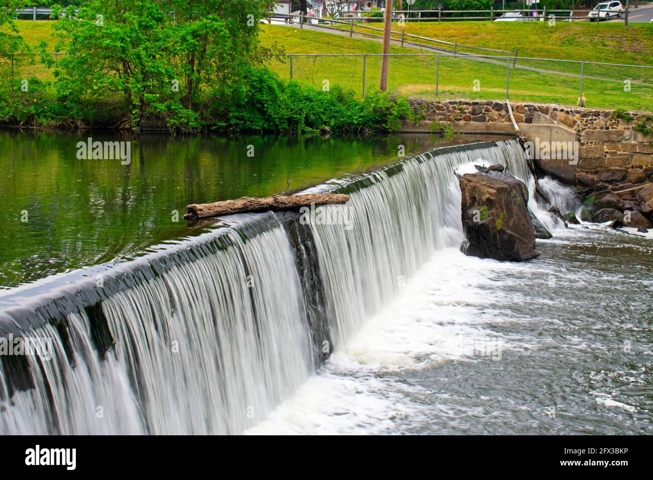 Waterfall created by a dam in Rockaway River at Grace Lord Park in ...